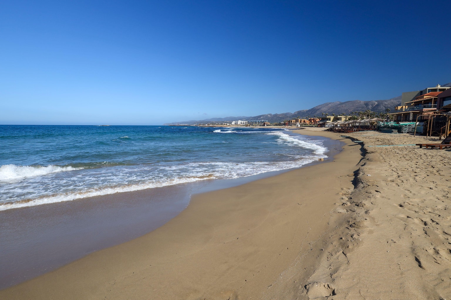 Malia Beach: A Haven for Crowd Enthusiasts and Water Sports Lovers ...