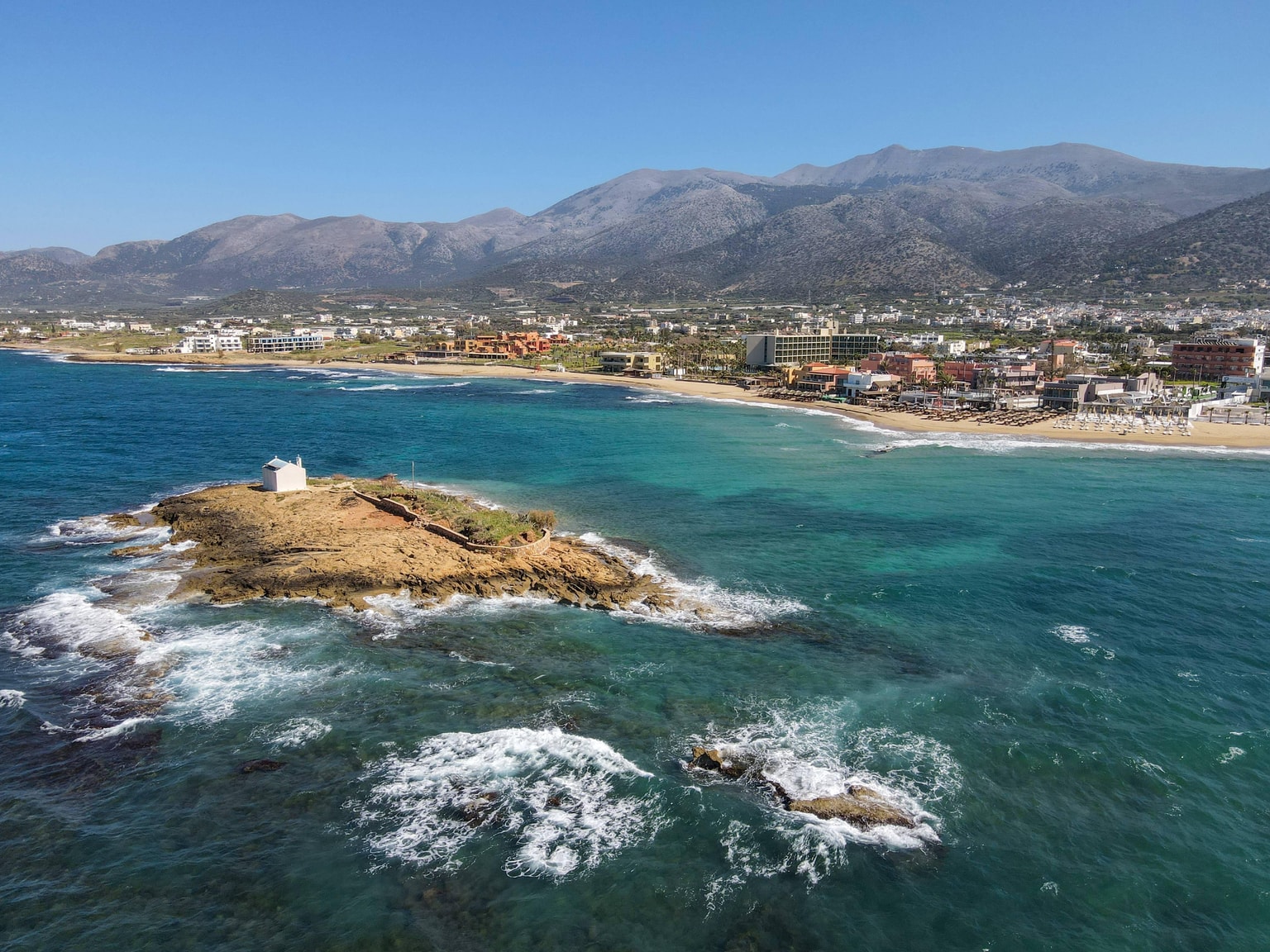 Malia Beach: A Haven for Crowd Enthusiasts and Water Sports Lovers ...