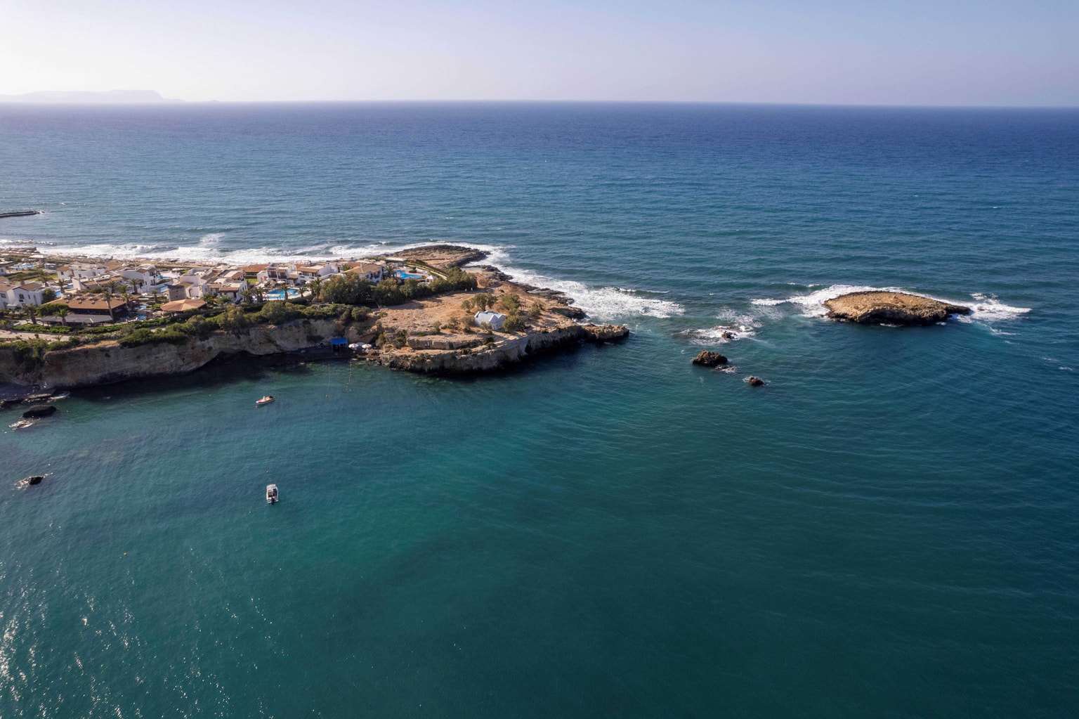 Limanakia: Serene Shores with White Sand, Pebbles, and Tranquil Green ...